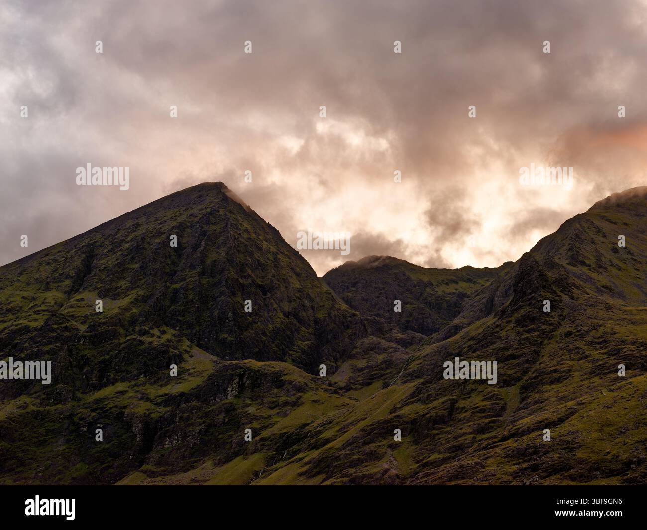 Carrauntoohil, the highest peak in Ireland, towers against a backdrop ...