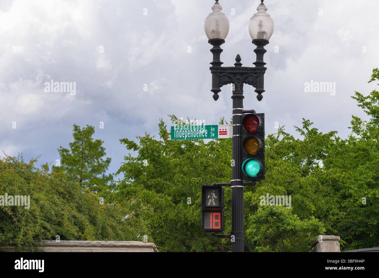 Streetlamp with a green traffic light and walk signal on Independence ...