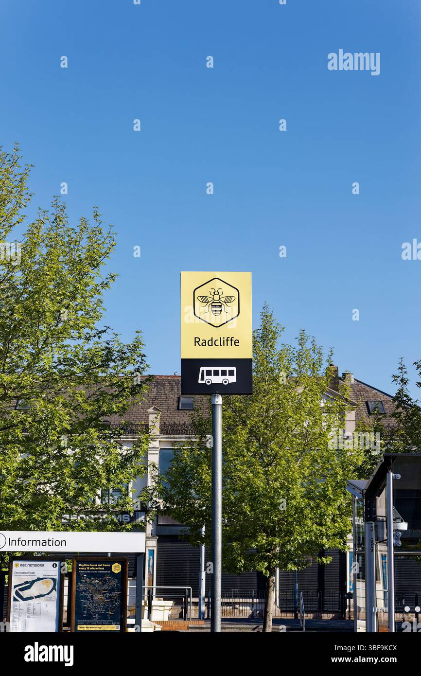 Bee network bus station sign with trees and bus station in background ...