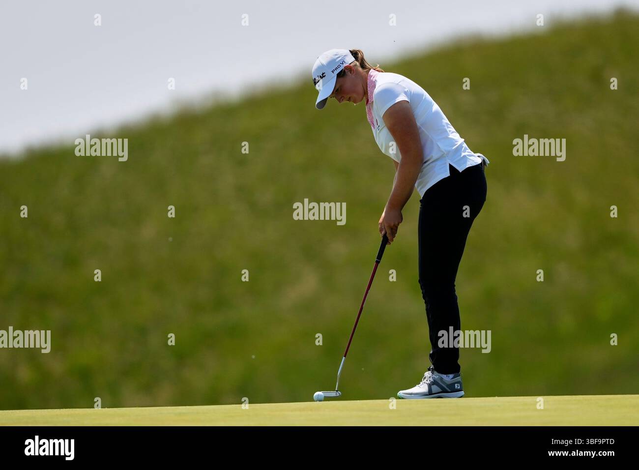 Lottie Woad, of England, putts on the 13th hople during the third round ...