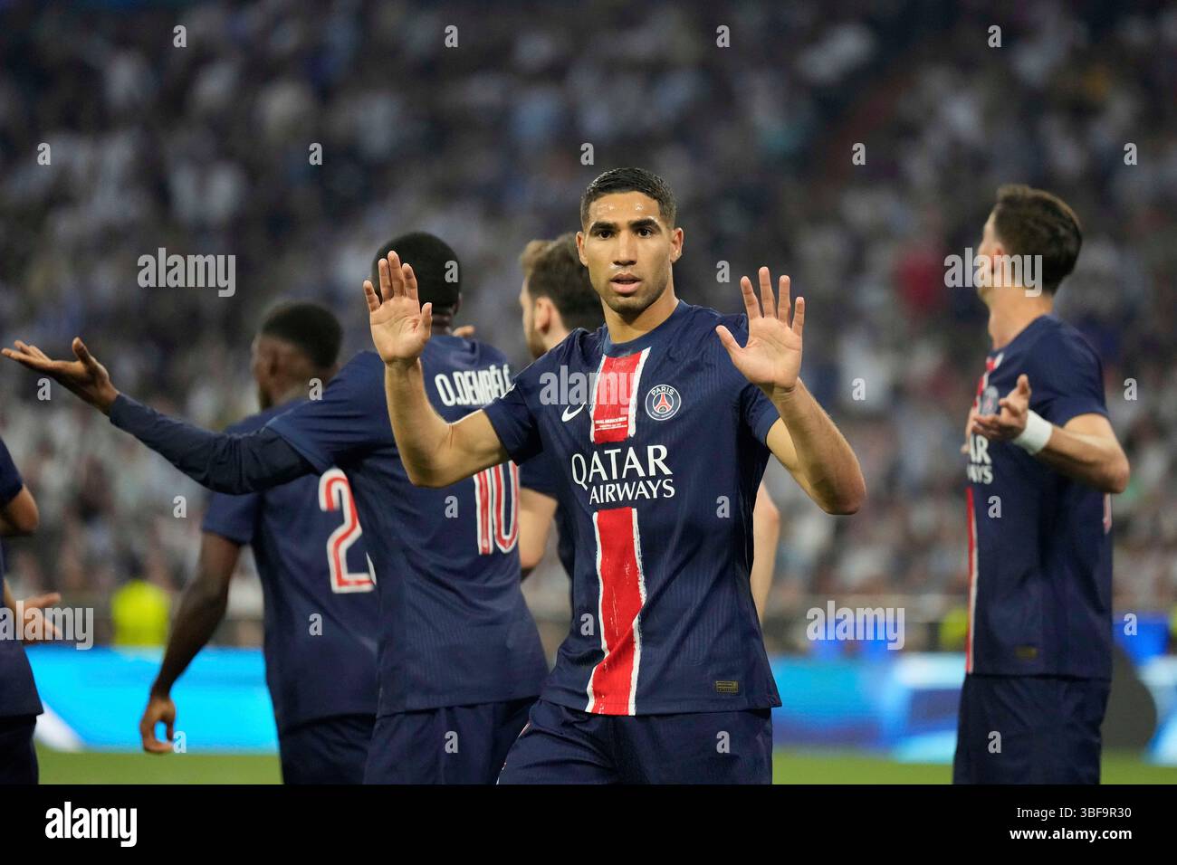 PSG's Achraf Hakimi celebrates after scoring his side's first goal ...