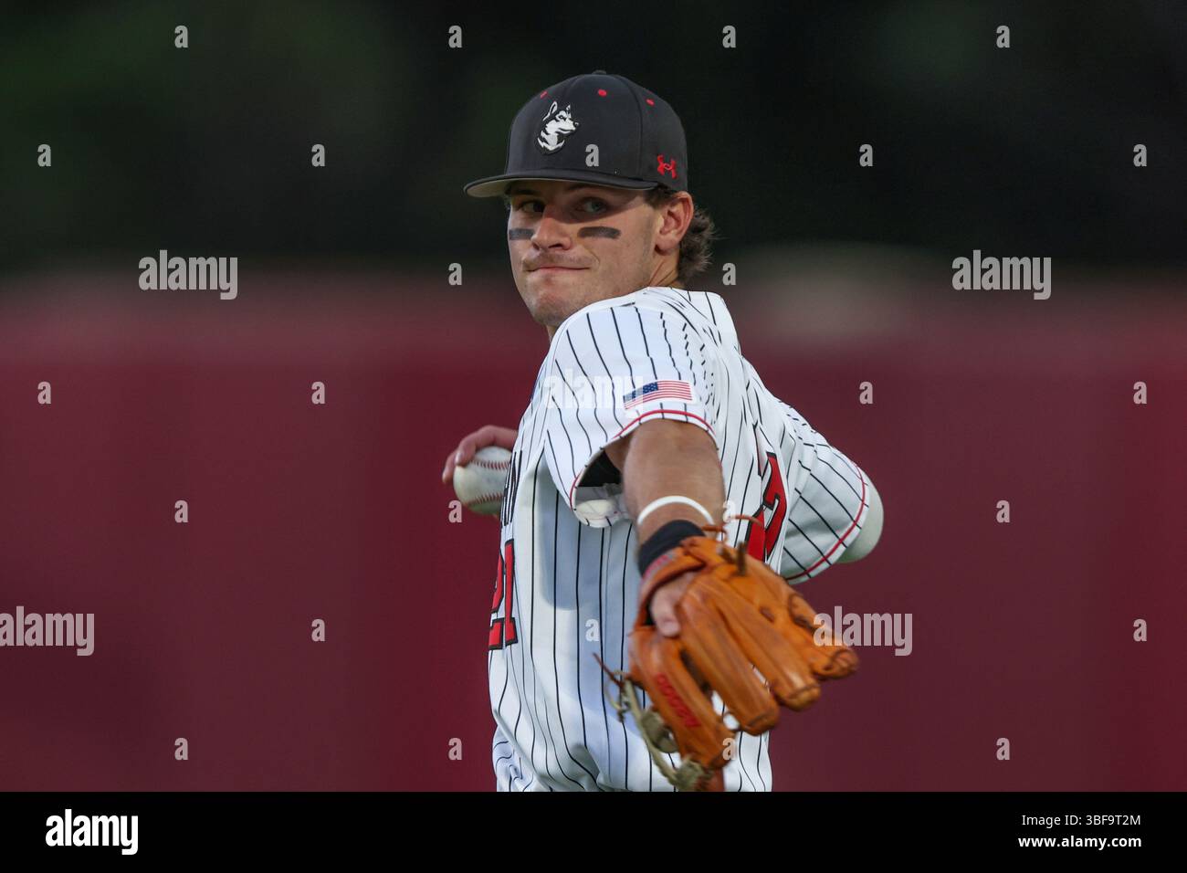 Northeastern infielder Jack Doyle (27) warms up before an NCAA regional ...