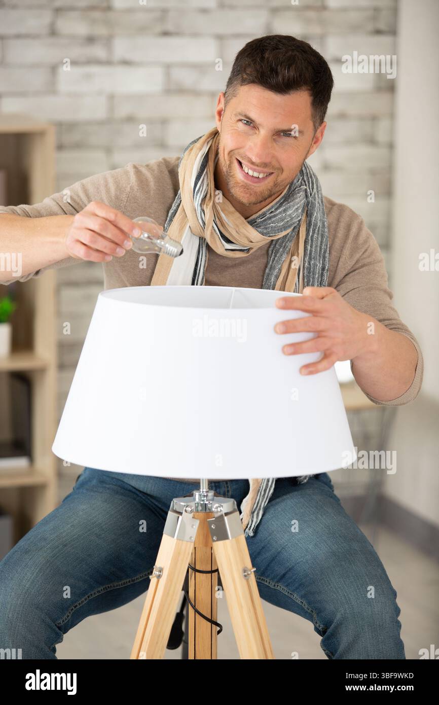 Happy man changing light hi-res stock photography and images - Alamy