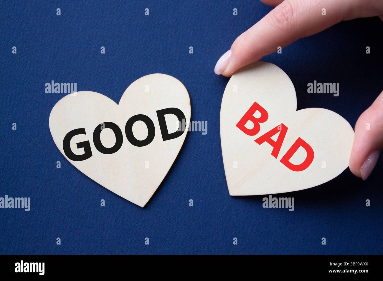 Good or Bad symbol. Concept word Good or Bad on wooden hearts ...