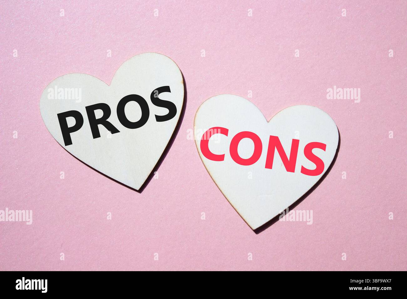 Pros vs Cons symbol. Concept word Pros vs Cons on wooden hearts ...