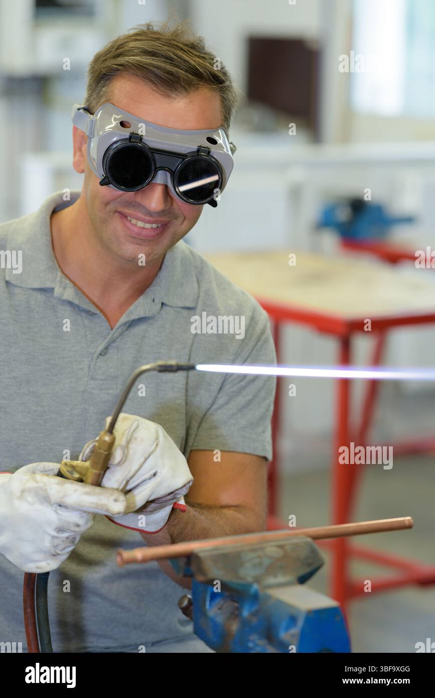 Welder worker heating copper hi-res stock photography and images - Alamy