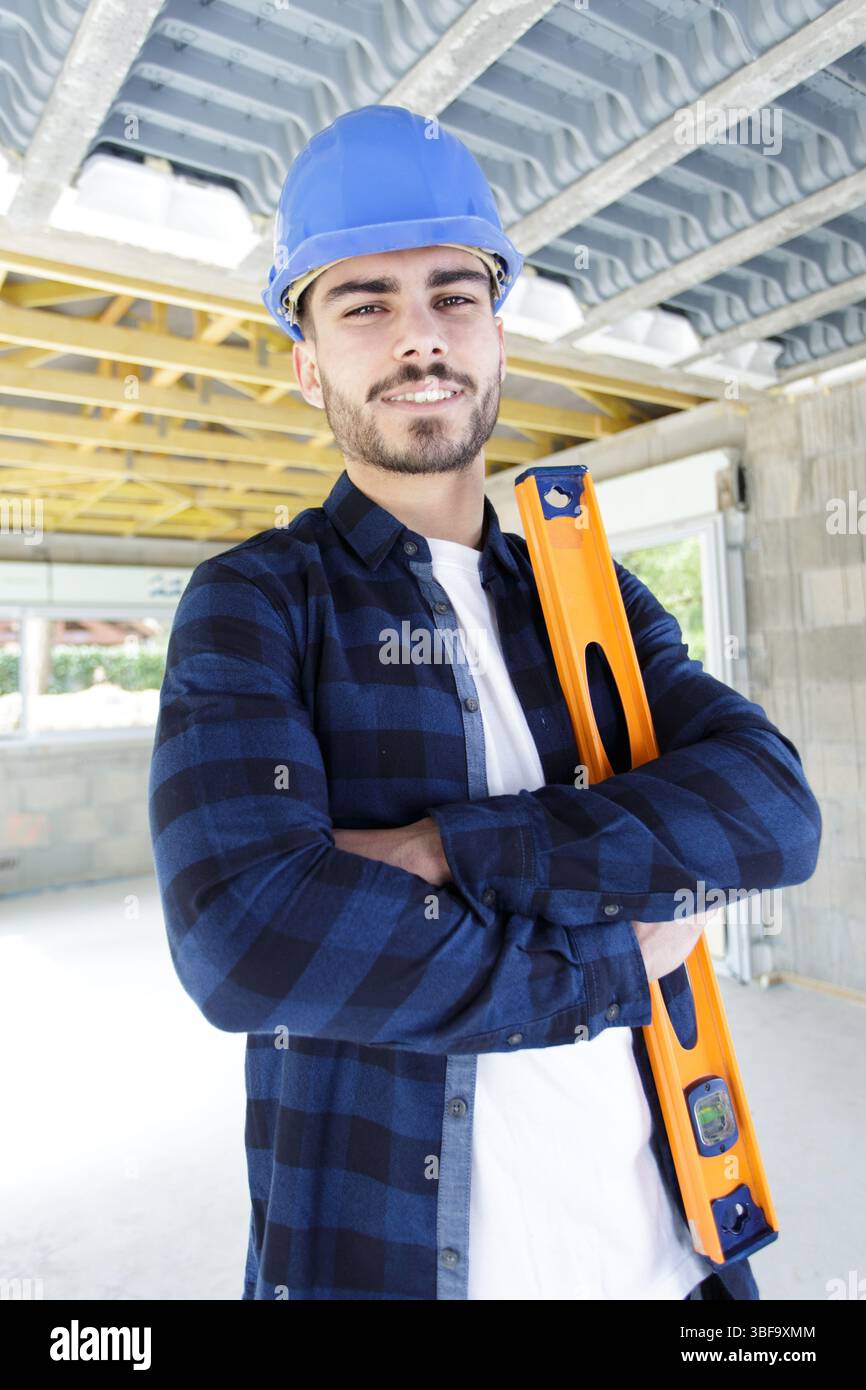 construction worker with spirit level Stock Photo - Alamy