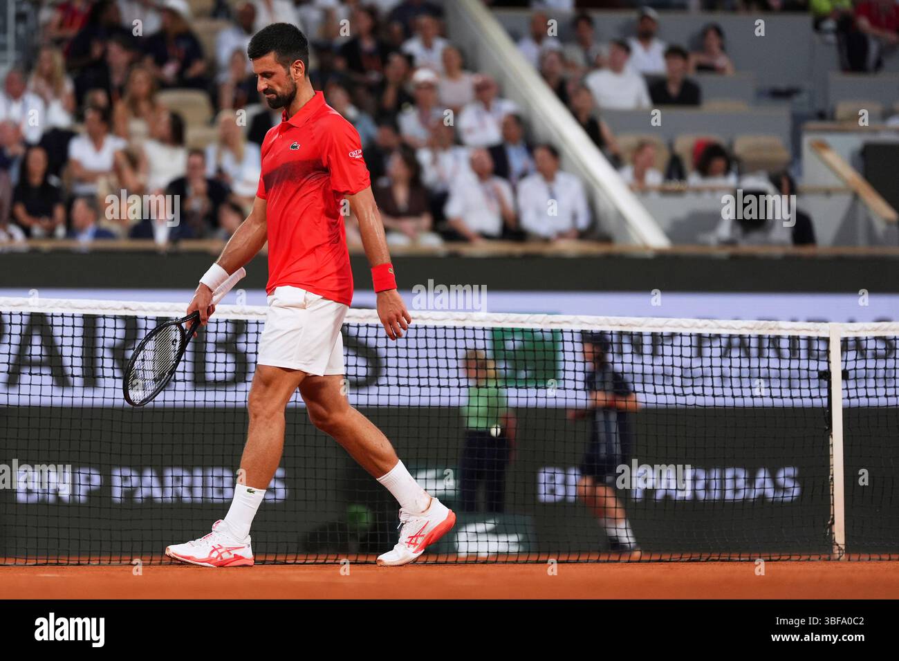Serbia's Novak Djokovic walks to the bench after winning the first set ...
