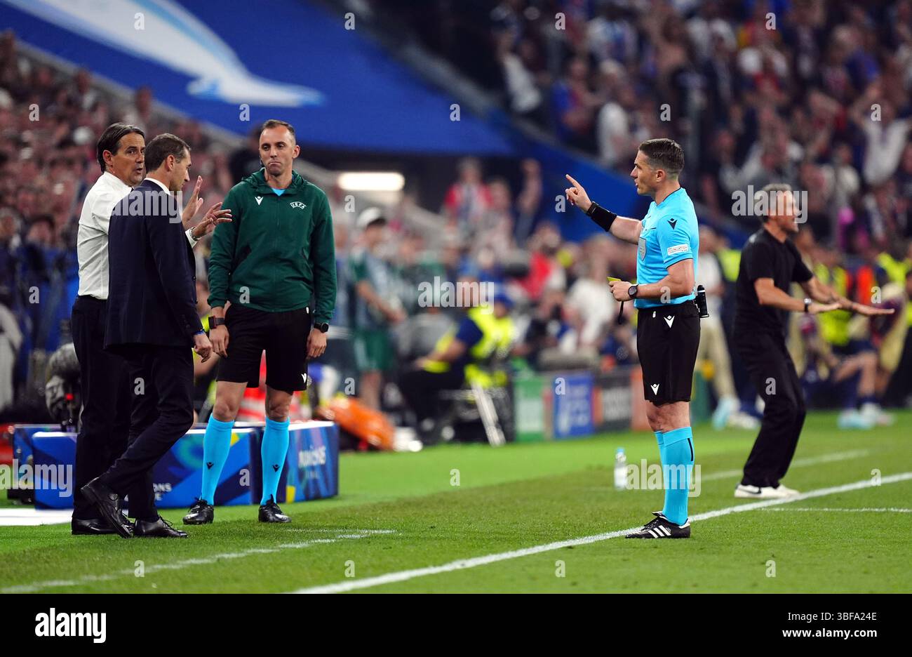 Inter Milan manager Simone Inzaghi is booked by referee Istvan Kovacs during the UEFA Champions ...