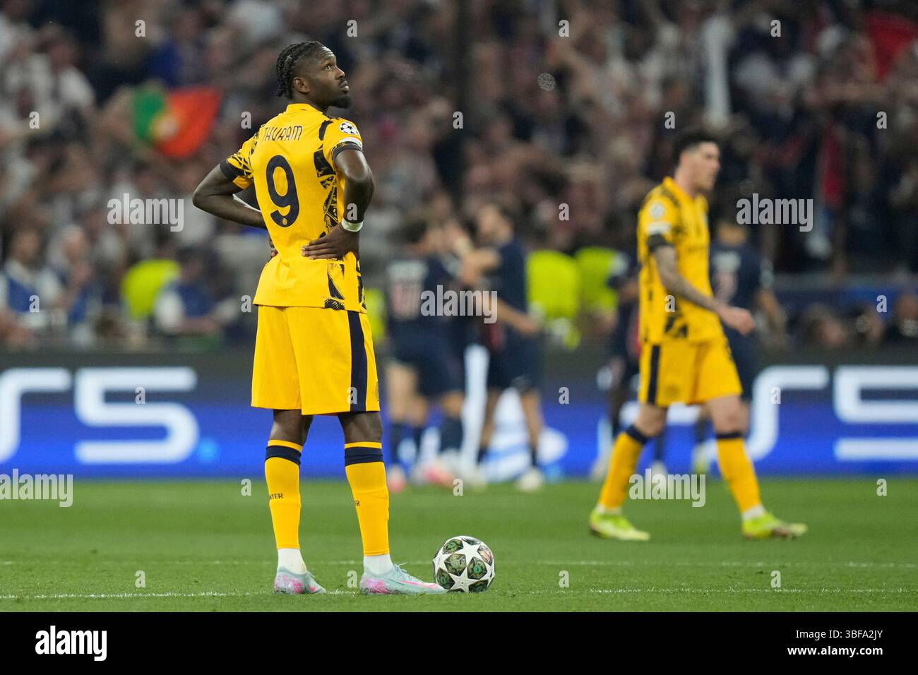 Inter Milan's Marcus Thuram is dejected after PSG's Desire Doue scored ...