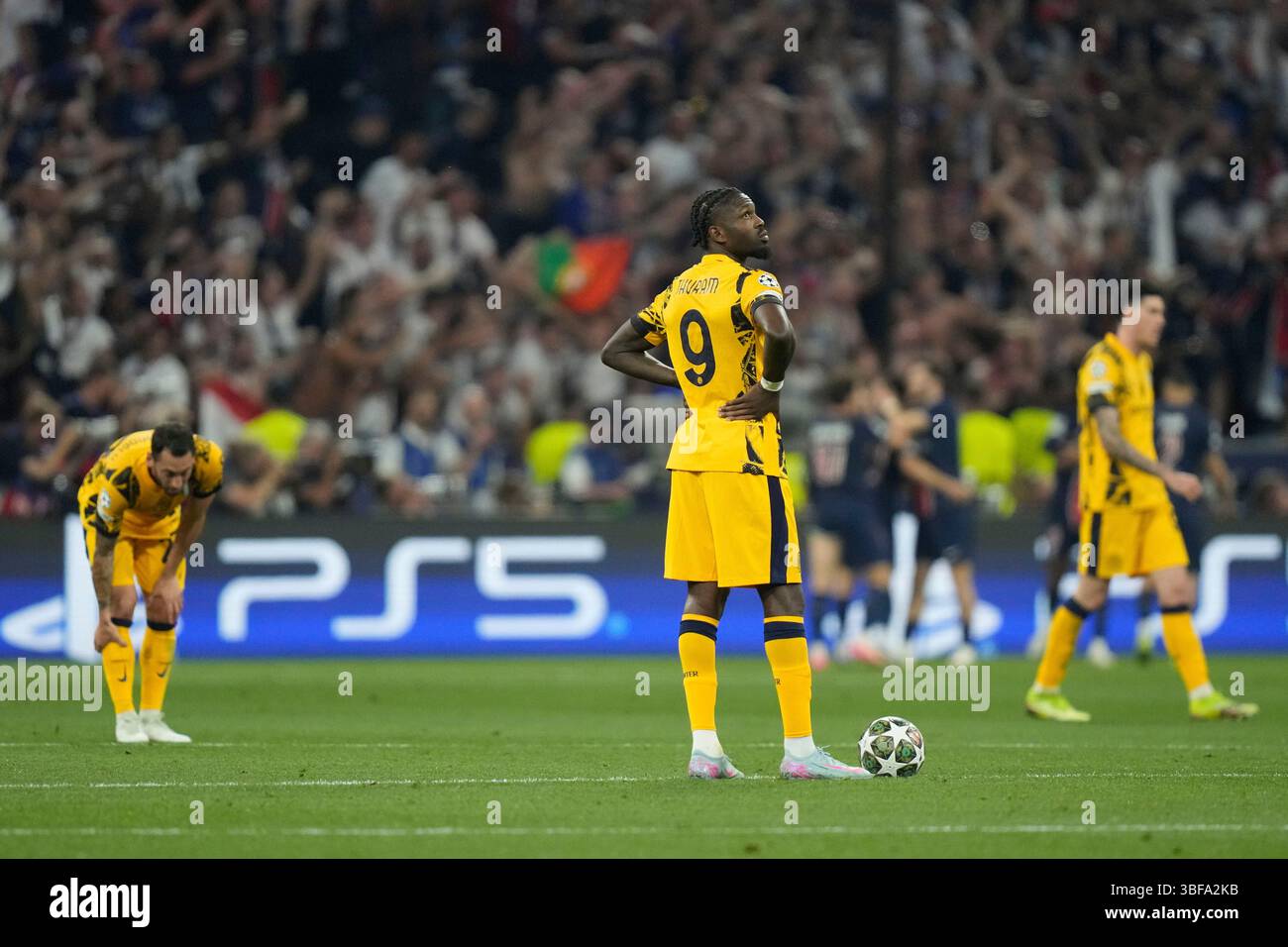 Inter Milan's Marcus Thuram is dejected after PSG's Desire Doue scored ...