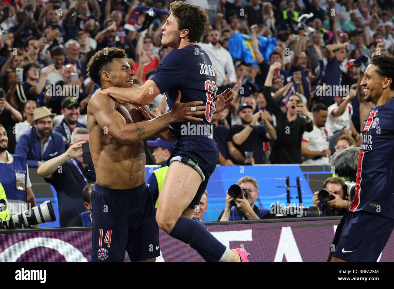 PSG's Desire Doue, left, celebrates after he scored thrid goal during ...