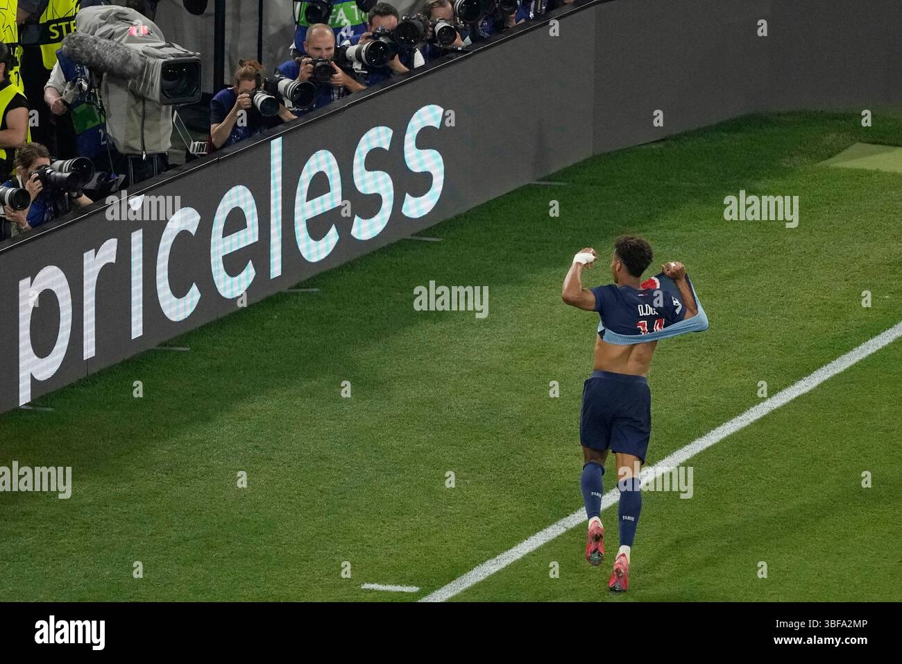 PSG's Desire Doue celebrates after scoring his side's third goal ...