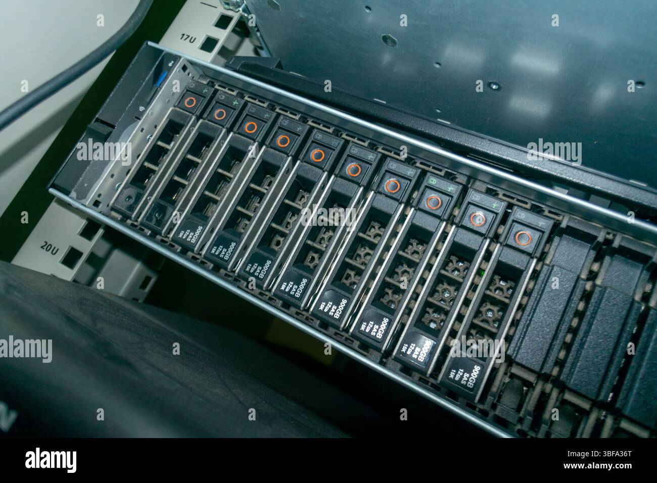 Detailed view of a server rack showcasing multiple storage drives. This ...