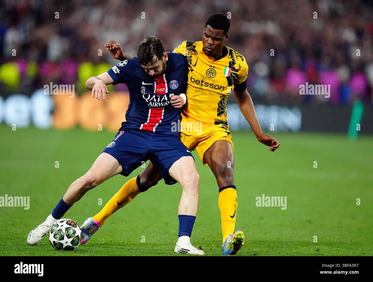 Inter Milan's Denzel Dumfries and Paris Saint-Germain's Khvicha Kvaratskhelia (left) battle for ...
