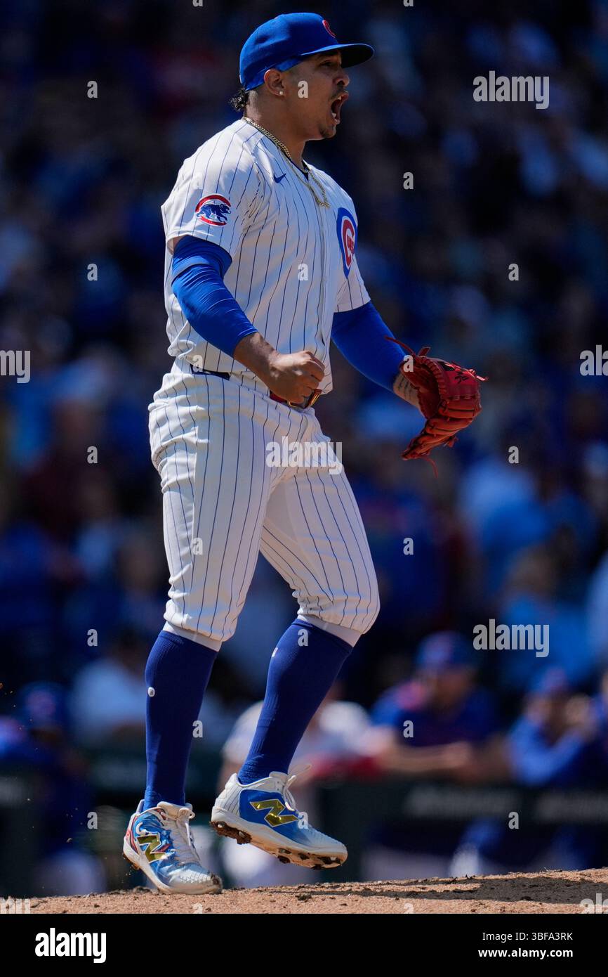 Chicago Cubs pitcher Daniel Palencia (48) reacts to striking out ...