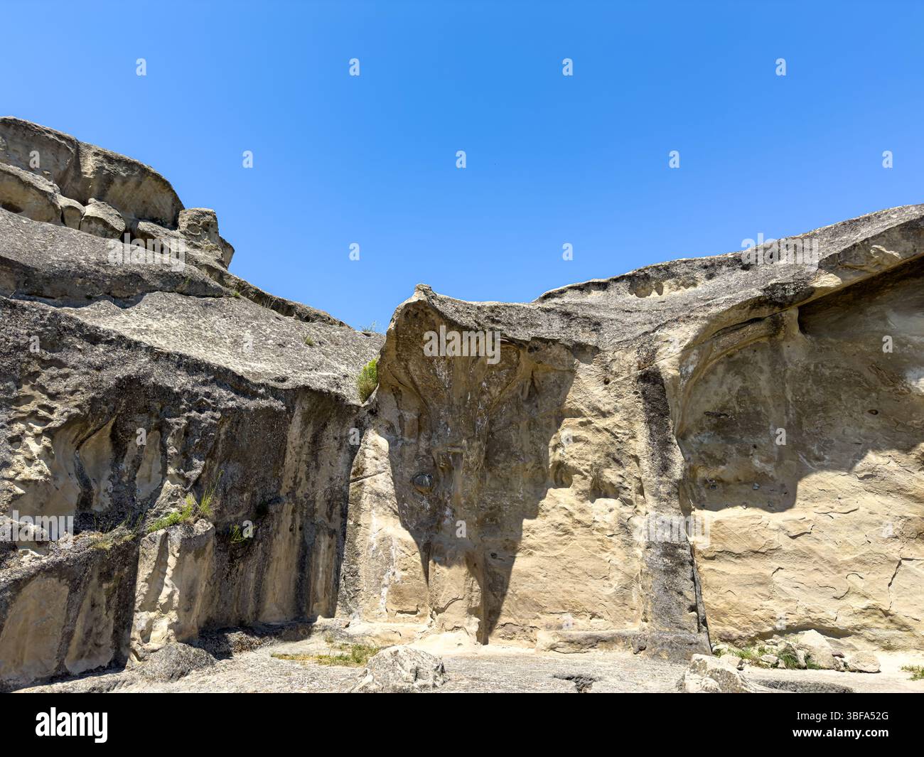 Rock formations and carved cave walls in the ancient cave city of ...