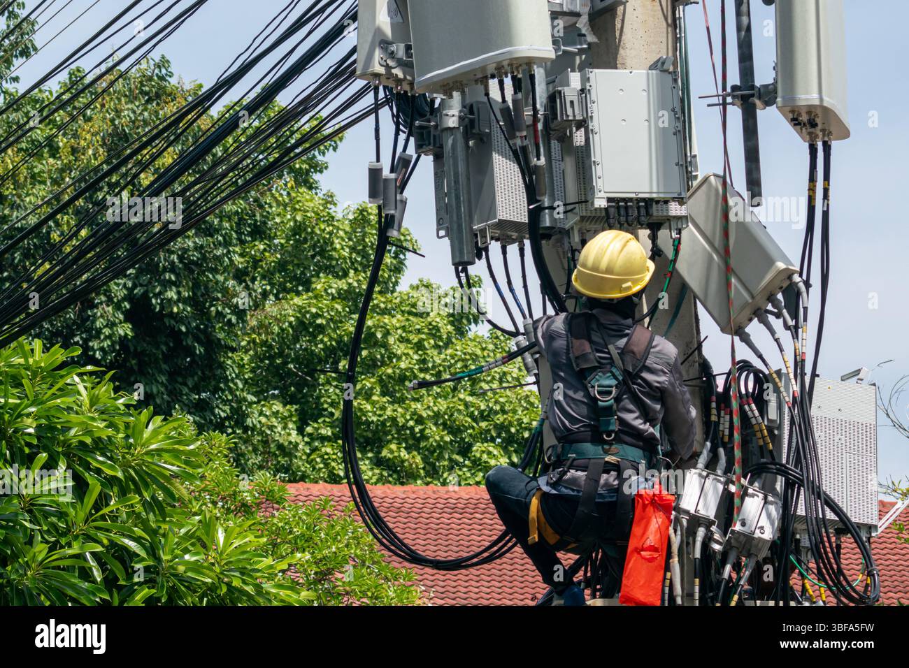 Worker climbing utility pole hi-res stock photography and images - Alamy