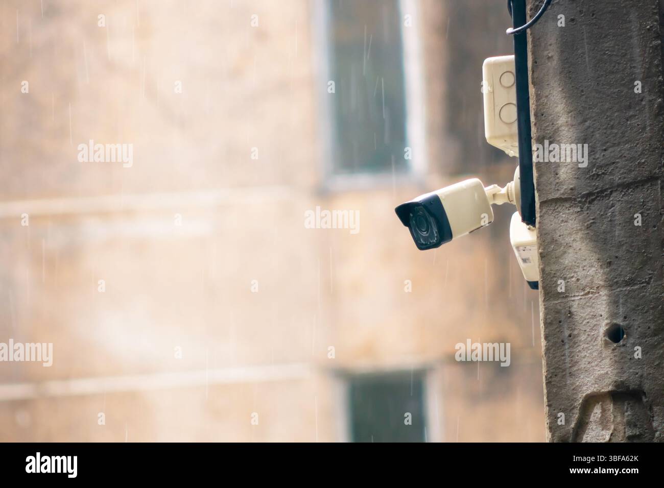 A detailed view of a CCTV camera mounted on a utility pole during ...