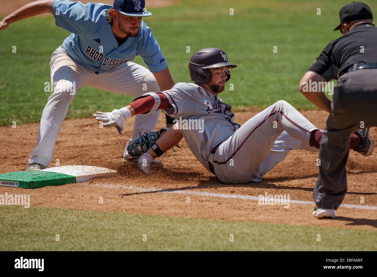 Rhode Island infielder DJ Perron (26) tags out Little Rock utility Ty ...