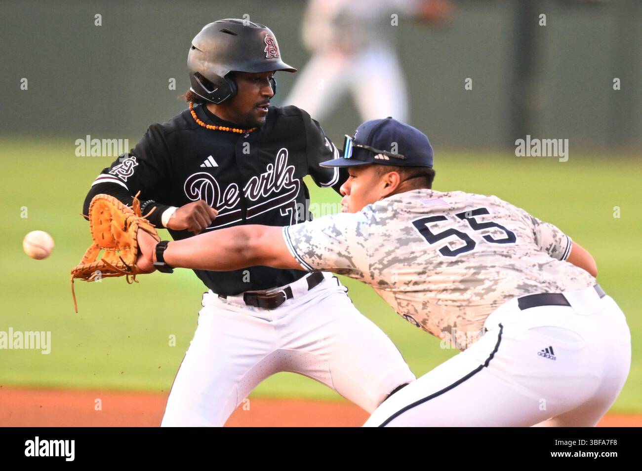 Arizona St. infielder Kyle Walker (7) gets back to first base while UC ...