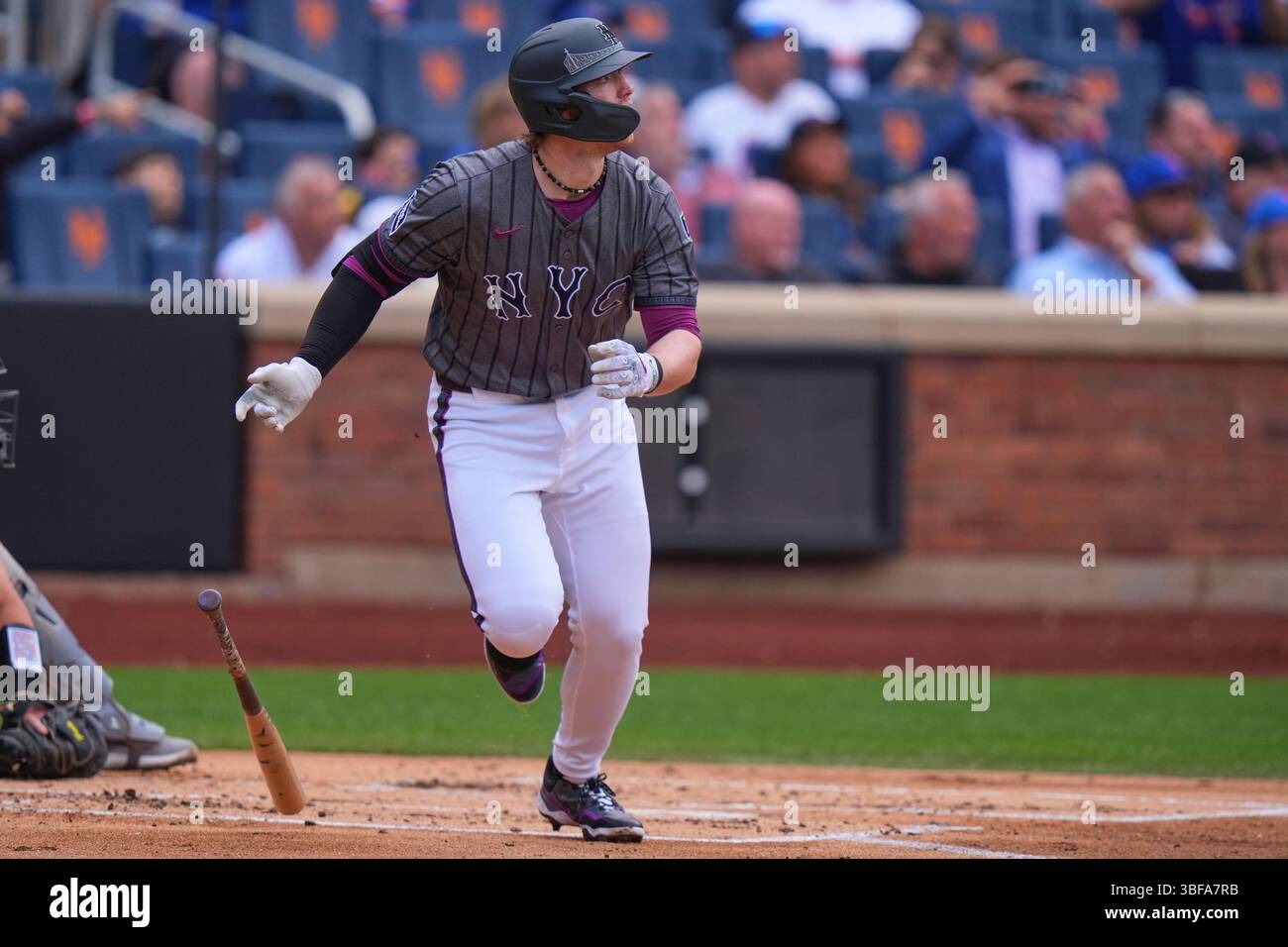 New York Mets' Brett Baty follows through on a three-run triple during ...