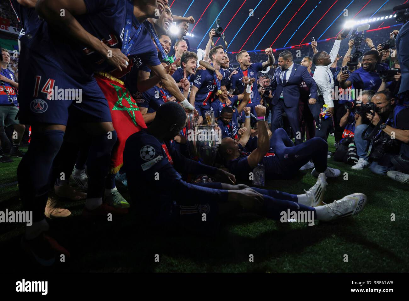 PSG players celebrate with a trophy after the Champions League final ...