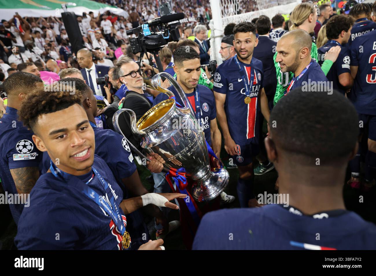 PSG players celebrate with a trophy after the Champions League final ...