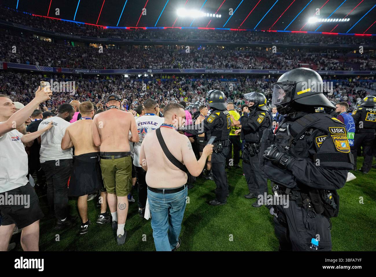 PSG fans invade the field at the end of the Champions League final soccer match between Paris ...