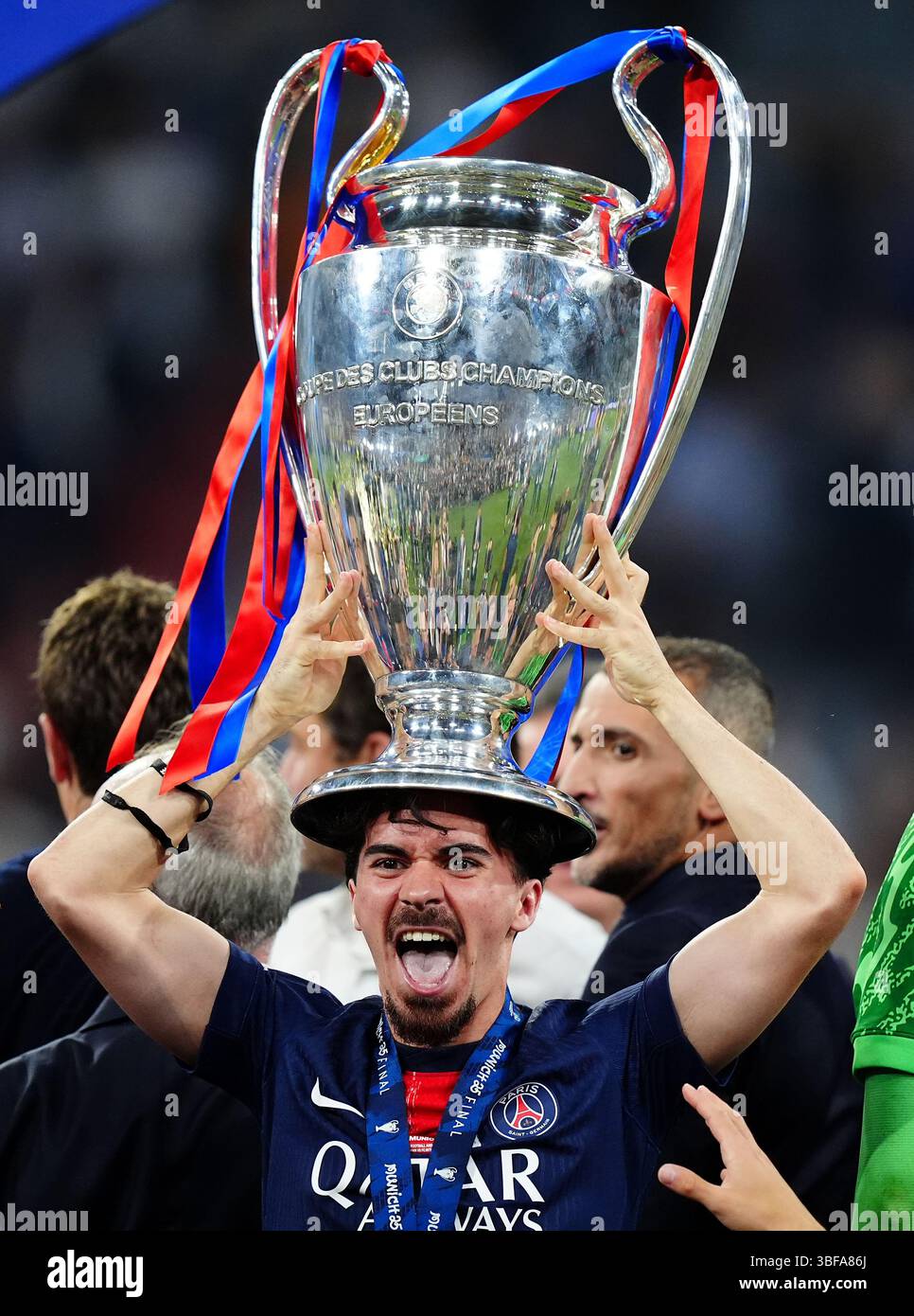 Paris Saint-Germain's Vitinha with the trophy after winning the UEFA ...