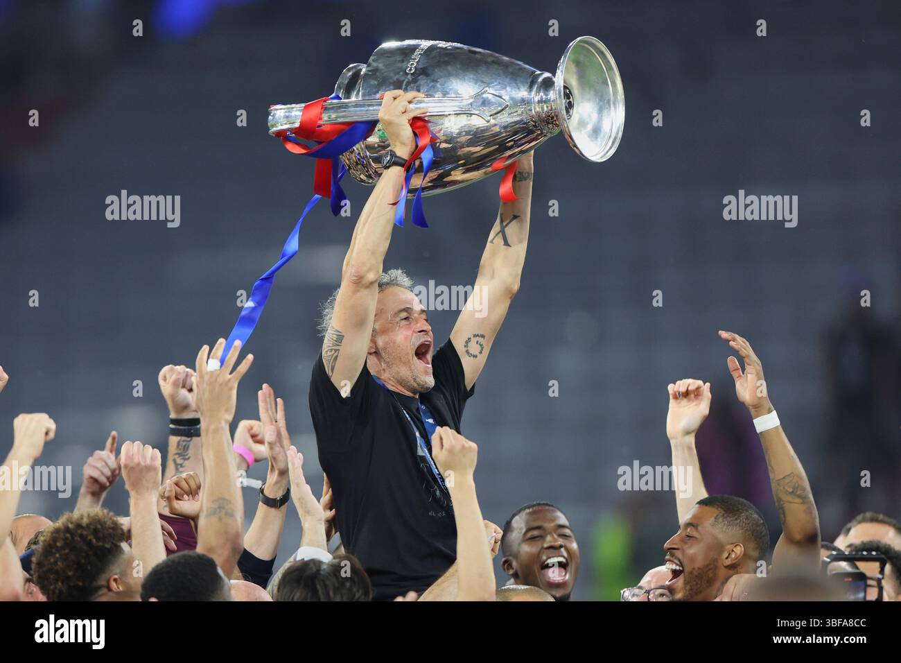 PSG's head coach Luis Enrique lifts the trophy after the Champions ...