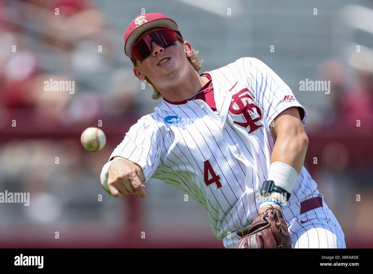 Florida State infielder Cal Fisher (4) warms up before an NCAA regional ...