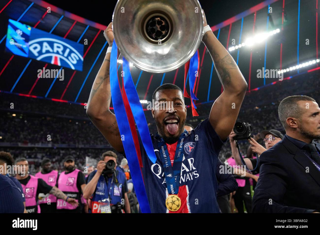 PSG's Presnel Kimpembe poses with the trophy after the Champions League ...
