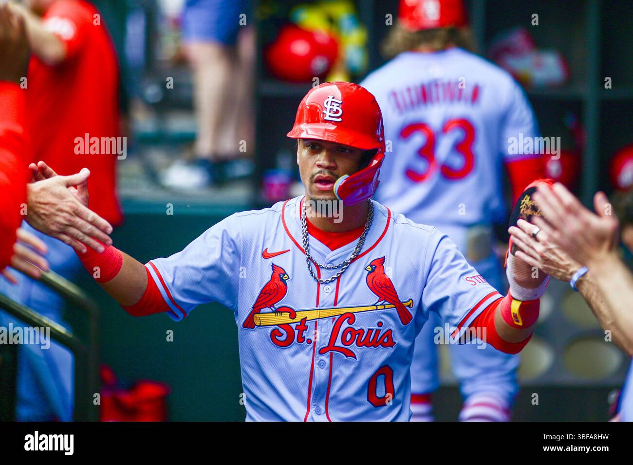 St. Louis Cardinals' Masyn Winn is greeted in the dugout after scoring ...