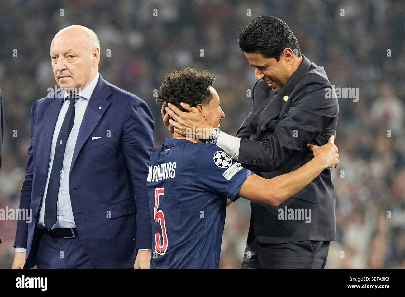 PSG president Nasser Al-Khelaifi hugs PSG's Marquinhos, center, at the ...