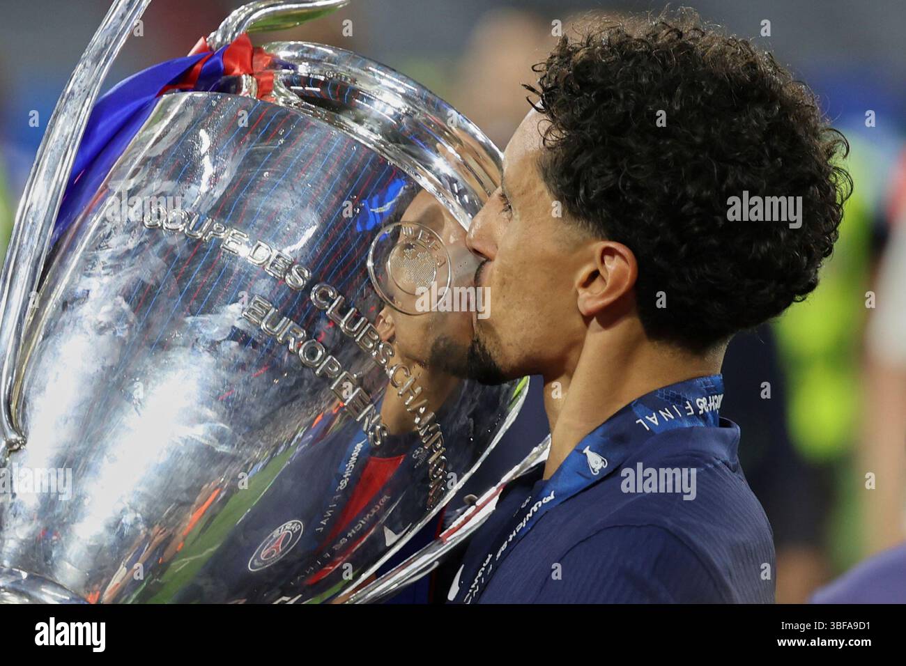 PSG's Marquinhos kisses the trophy after the Champions League final ...