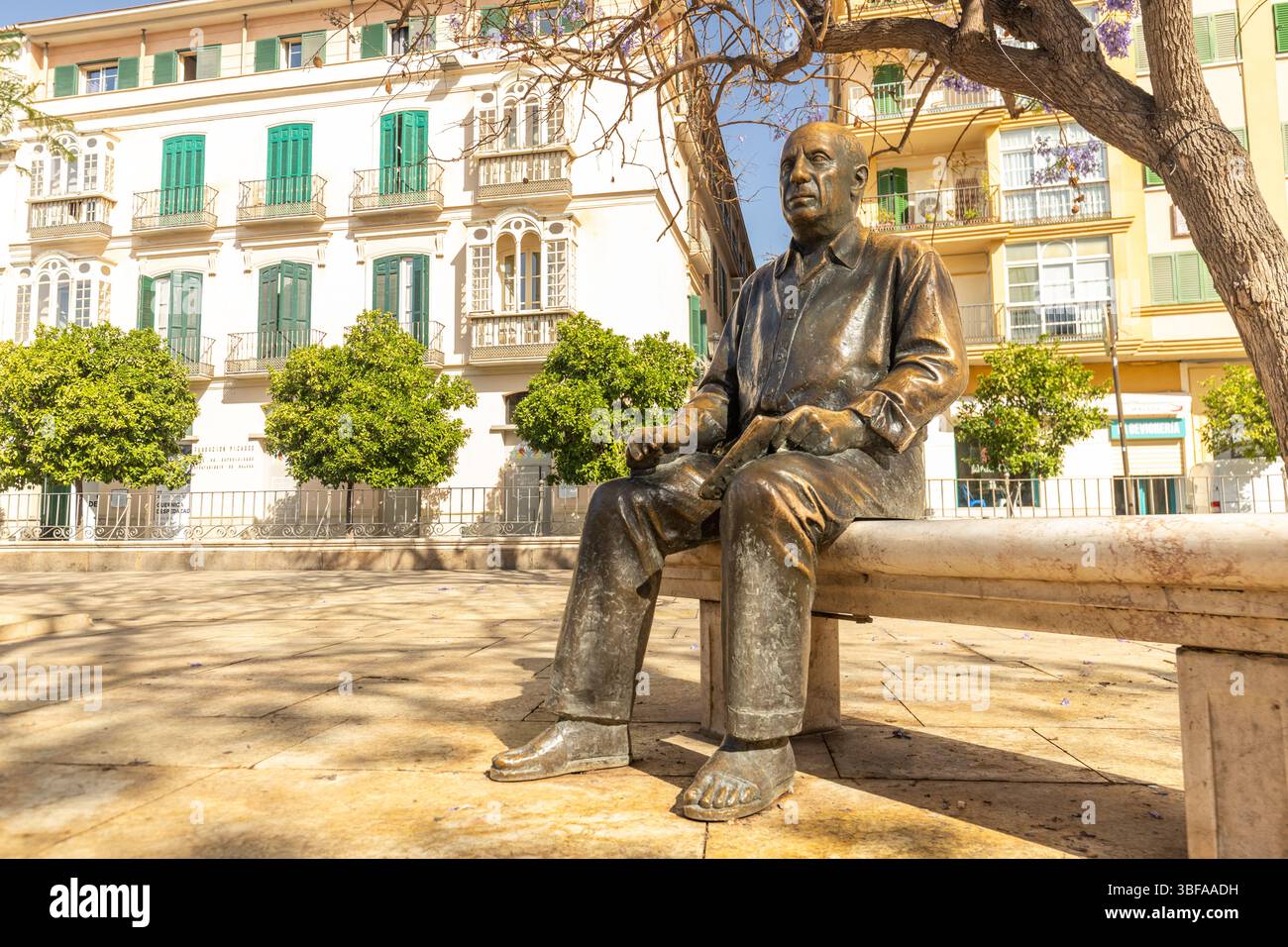 Sculpture of Pablo Ruiz Picasso sitting on a bench in the Plaza de la ...