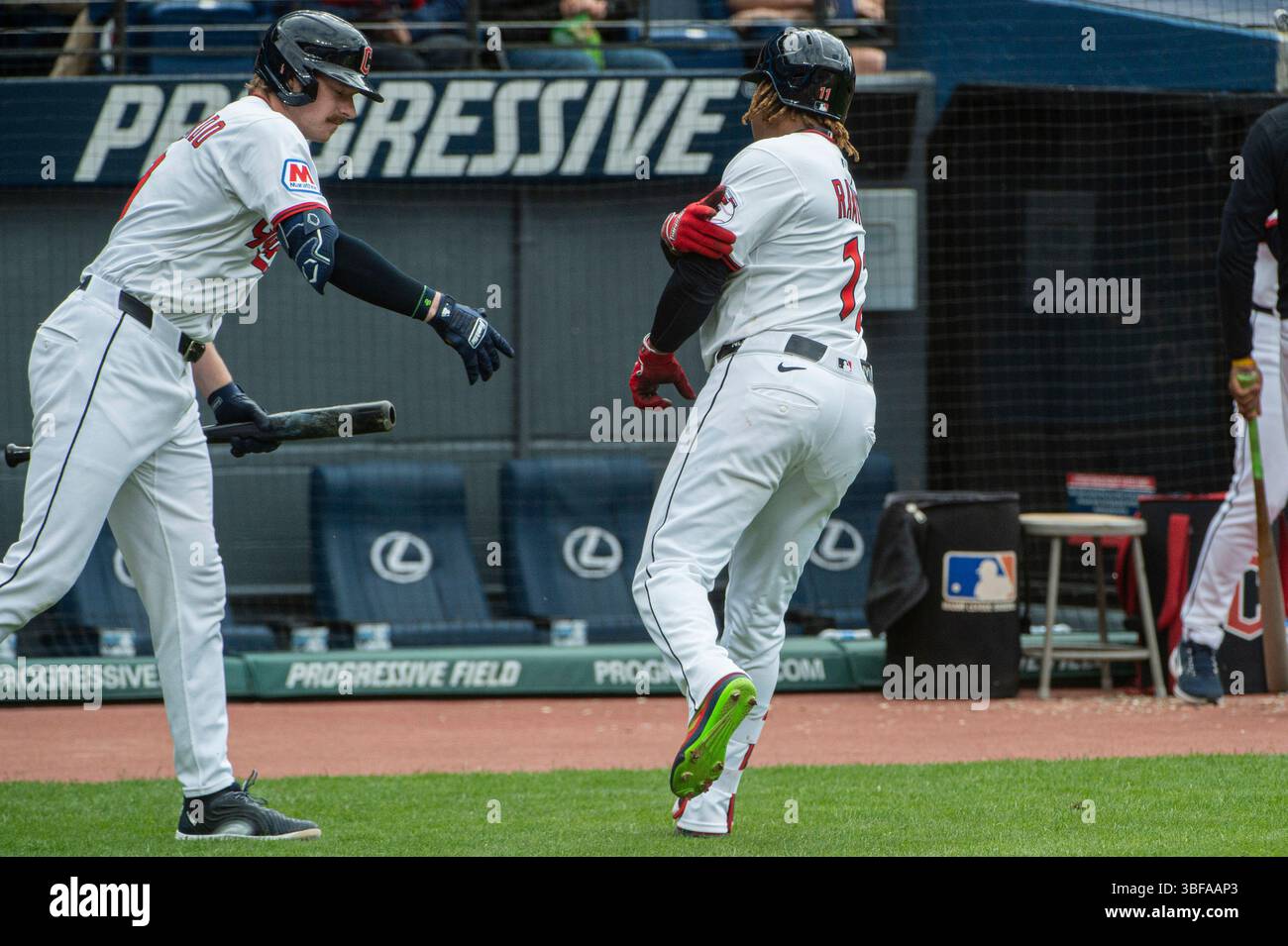 Cleveland Guardians' Kyle Manzardo, left, congratulates Jose Ramirez ...