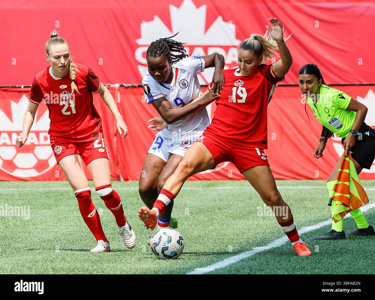 Canada's Adriana Leon (19) and Gabrielle Carle (21) defend against ...