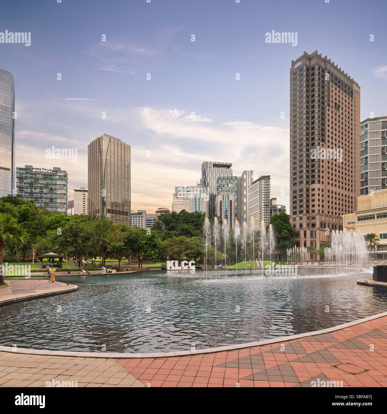 Kuala Lumpur, Malaysia - Feb. 17, 2025: Dusk at KLCC Park: fountains ...