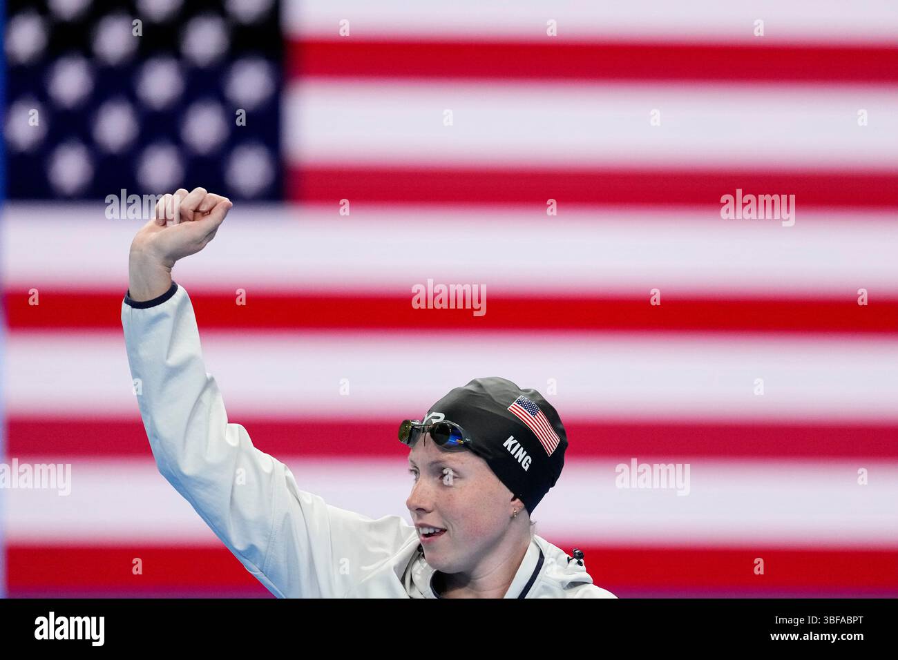 FILE - Lilly King, of the United States, waves ahead of the women's 100 ...