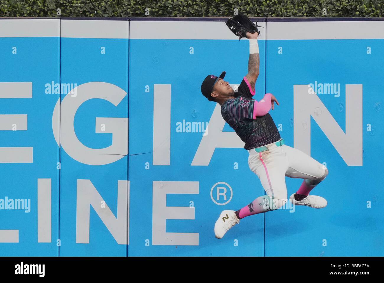 Miami Marlins right fielder Dane Myers catches a fly ball hit by San ...