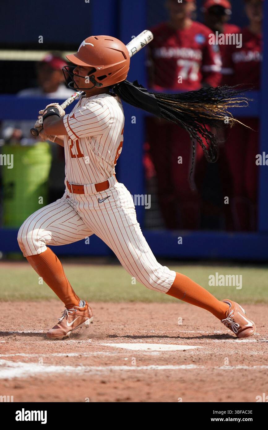 Texas outfielder Kayden Henry (21) hits a homer during an NCAA softball ...