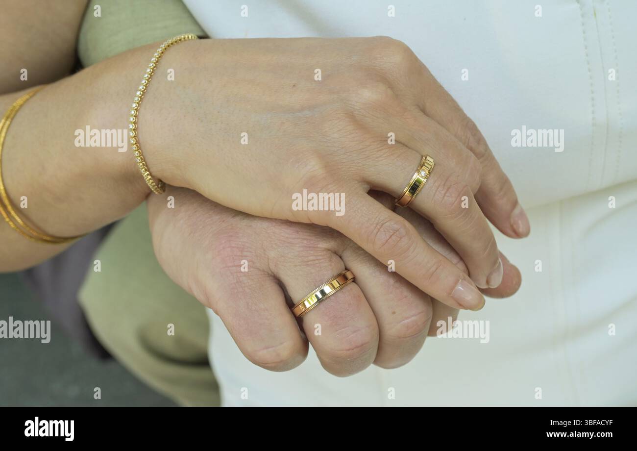 Mans hand womans golden hi-res stock photography and images - Alamy