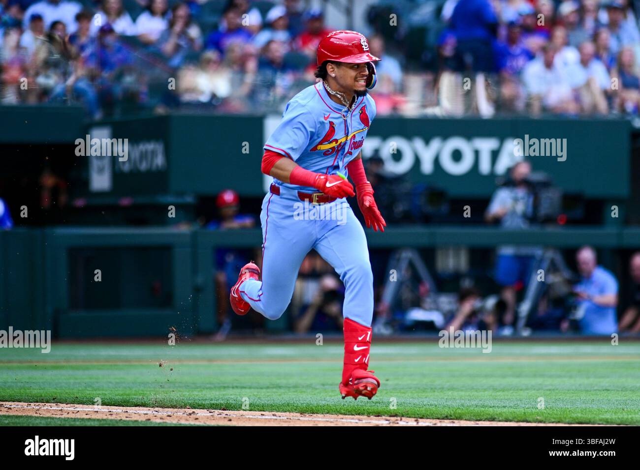 St. Louis Cardinals' Masyn Winn runs to first base during the eighth ...