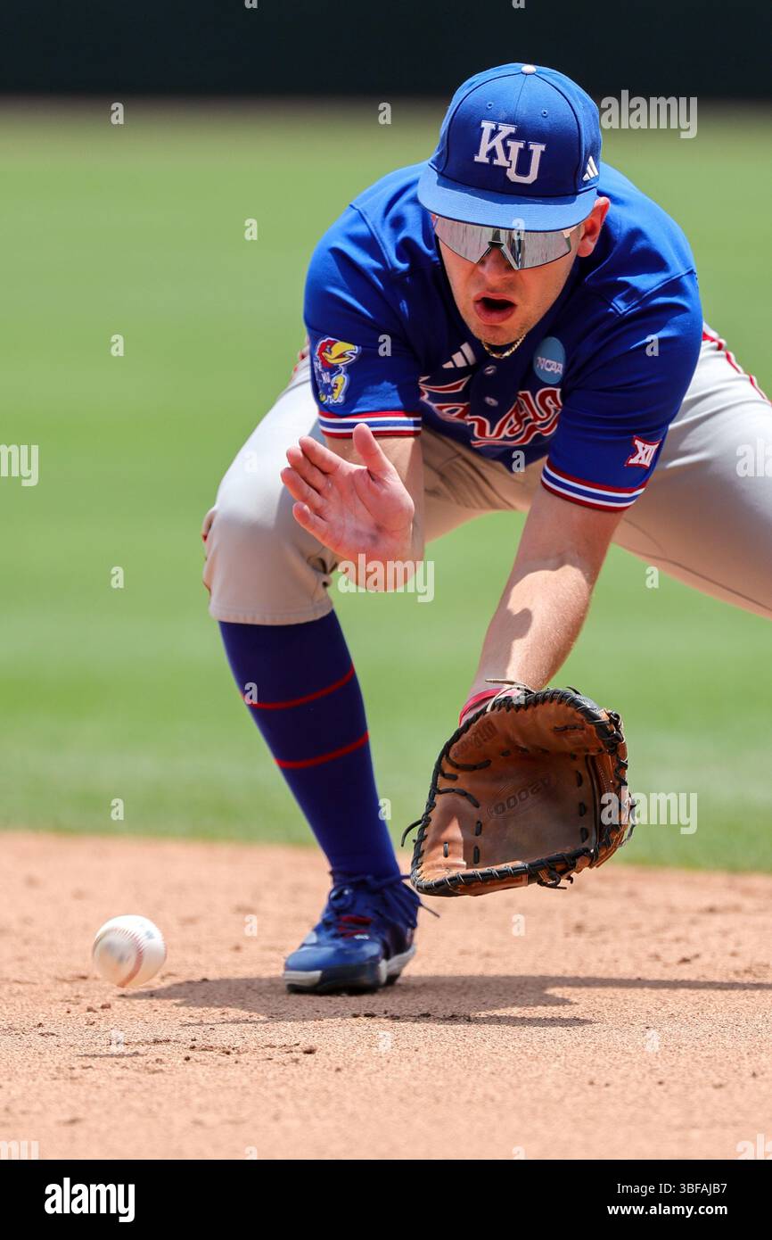 May 31, 2025: Kansas infielder Ty Wisdom (1) eyes a bouncing ball ...