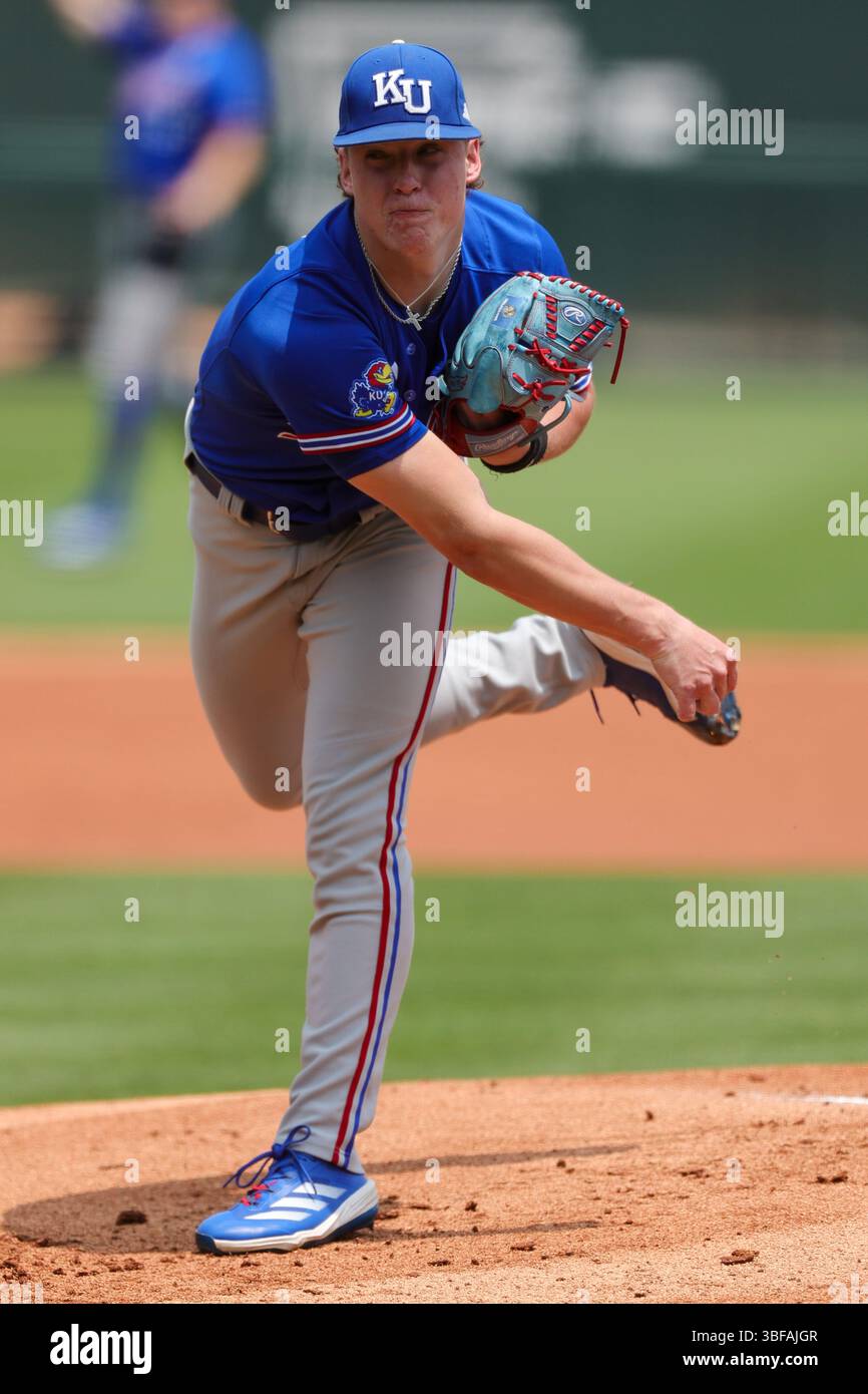 May 31, 2025: Jayhawks pitcher Cooper Moore (11) follows through on his ...