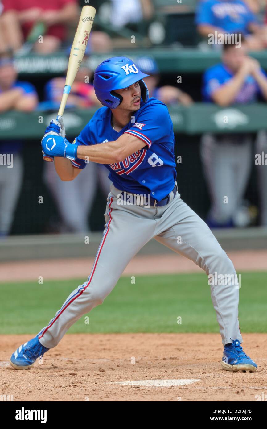 May 31, 2025: Kansas infielder Chase Diggins (8) begins his swing while ...