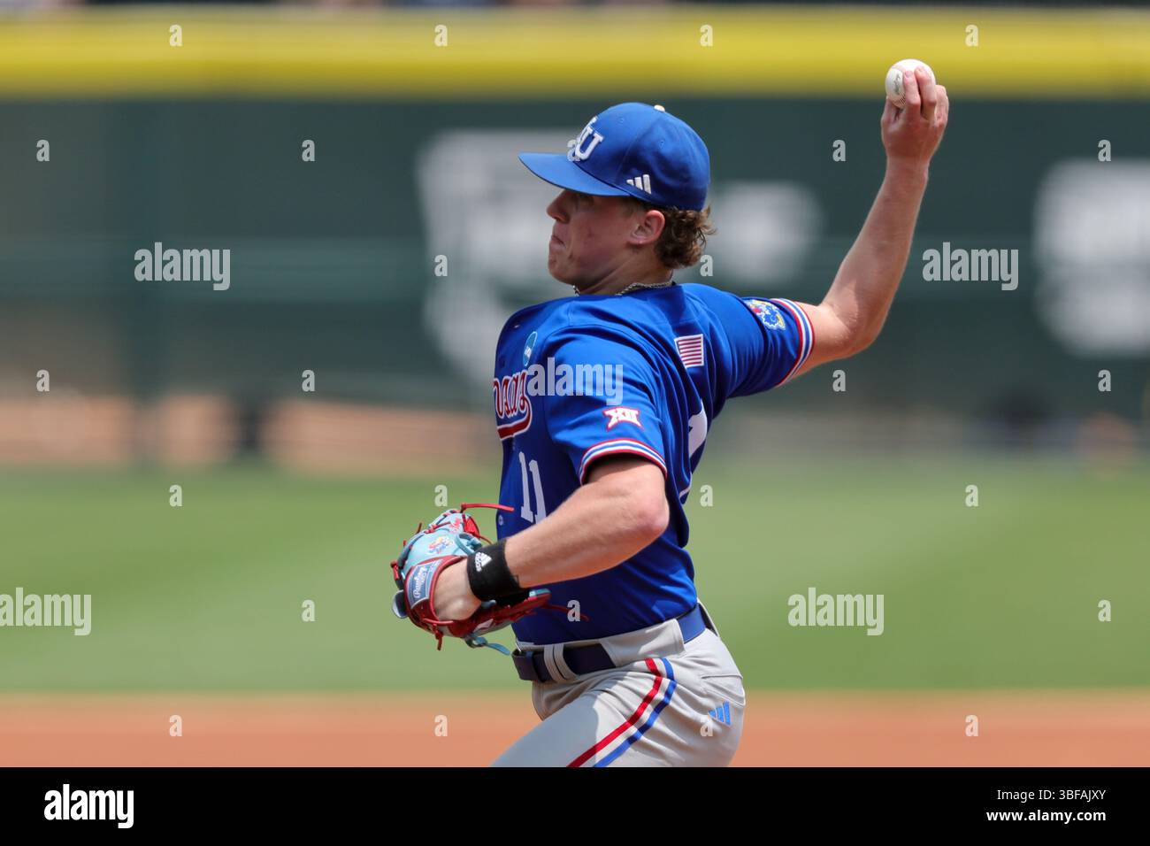 May 31, 2025: Cooper Moore (11) Kansas pitcher prepares to release the ...