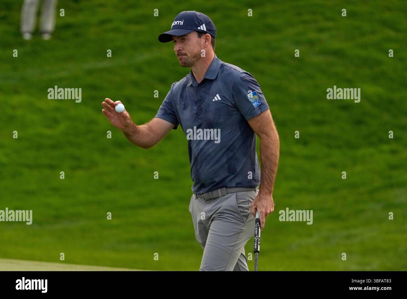 Nick Taylor gestures after his putt on the 18th green during the third ...